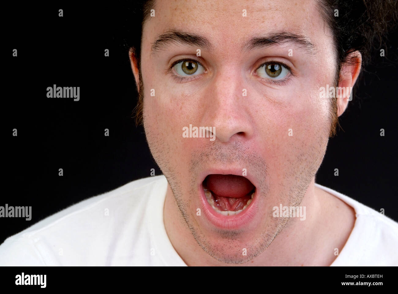 man looking scared into camera Stock Photo - Alamy