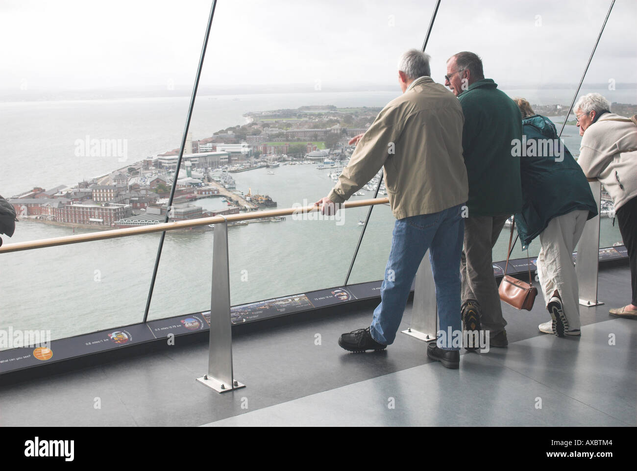Visitors to the Spinnaker Tower admire the maritime view from the ...