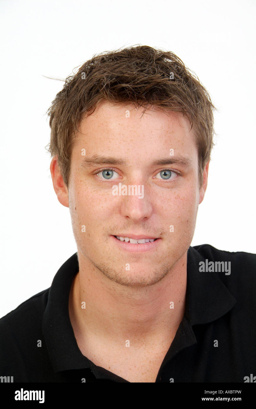 young good looking man smiling into the camera Stock Photo - Alamy