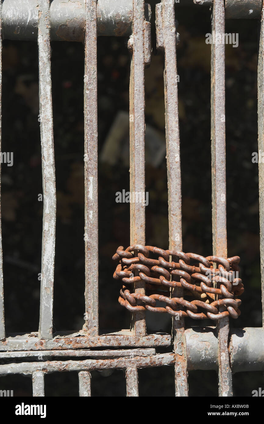 Chain wrapped around steel gate from above, vertical Stock Photo - Alamy