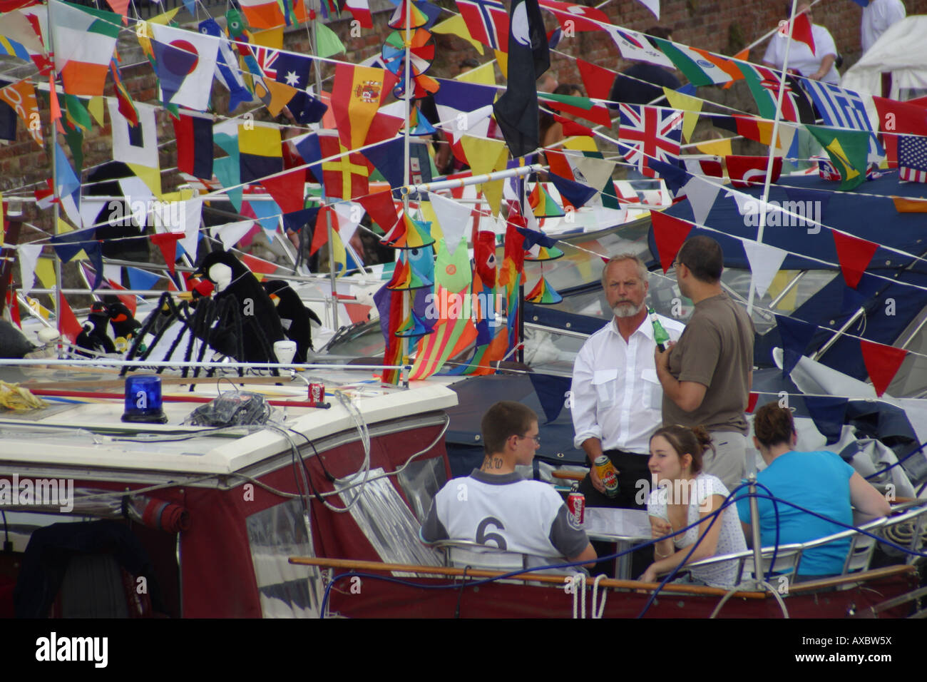 revellers boaters relaxing eating drinking flags river medway maidstone ...