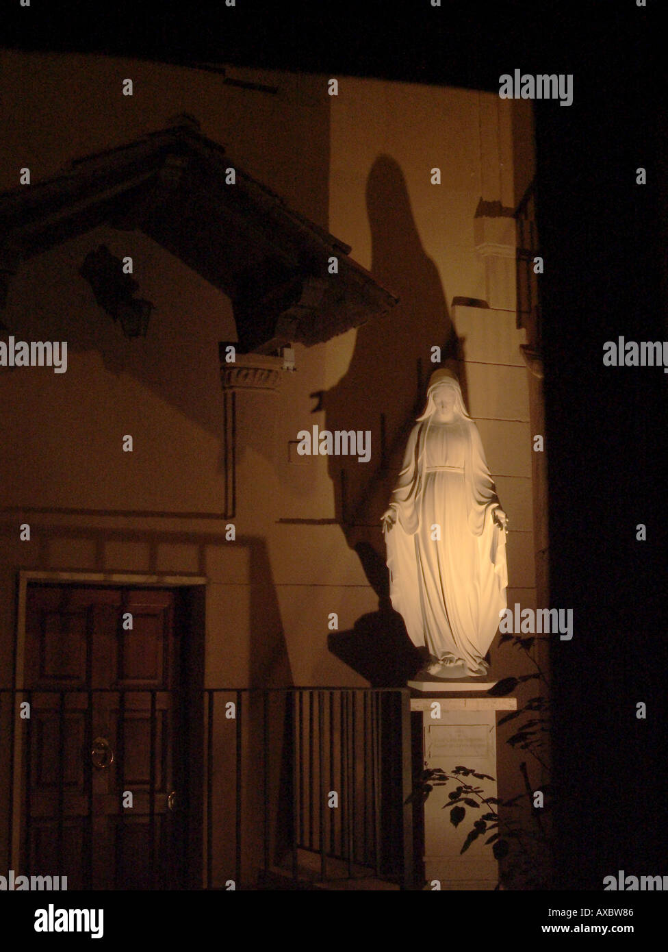 virgin mary statue in rome at night Stock Photo - Alamy