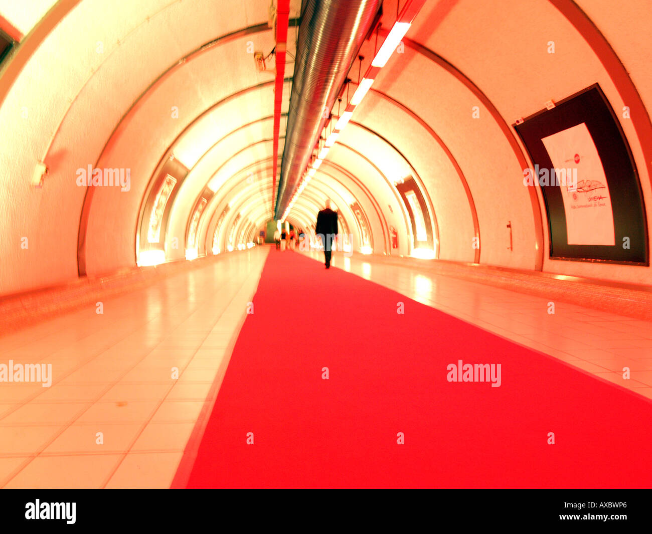 lone commuter walking in underground passage Stock Photo - Alamy