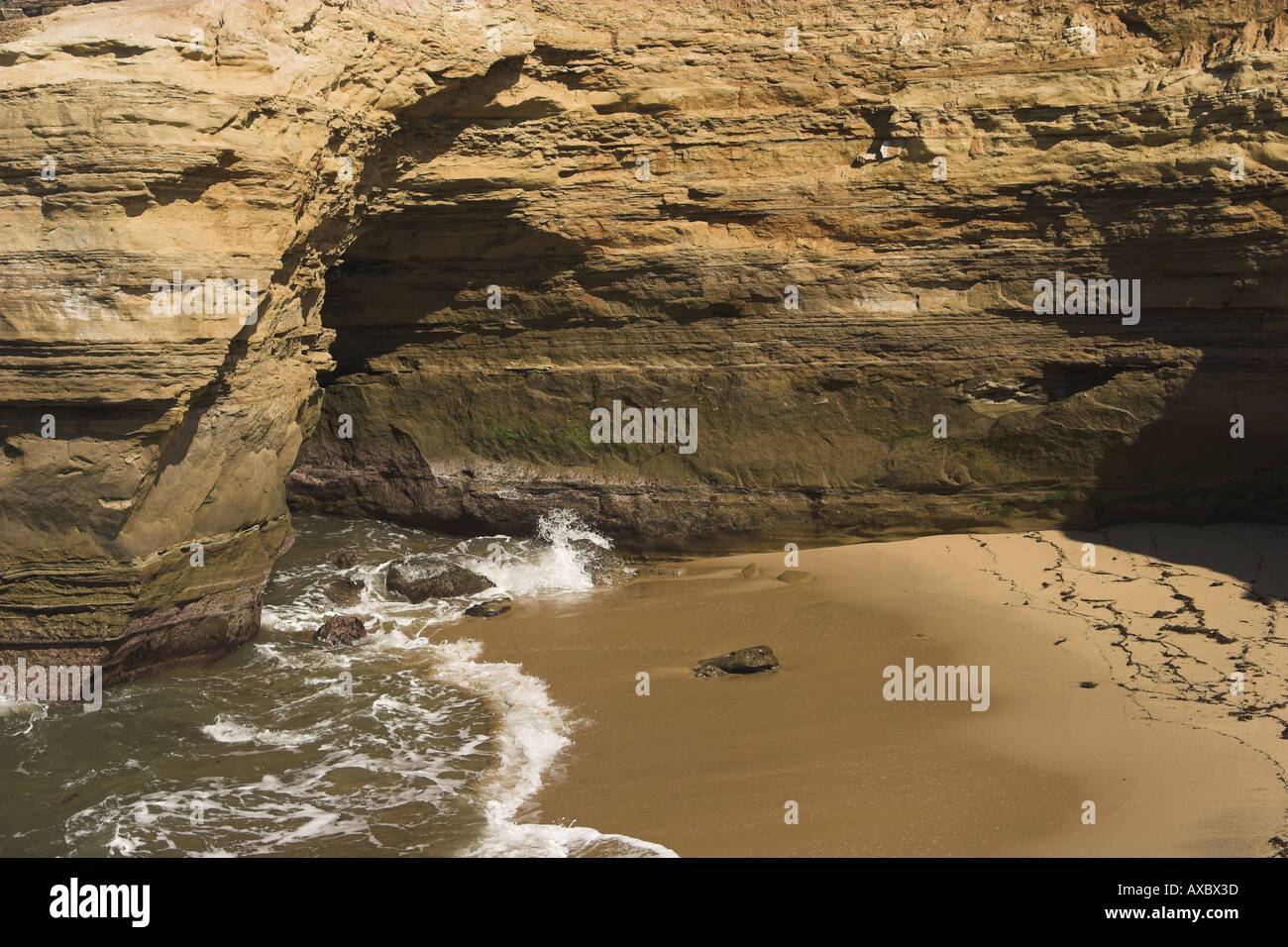 rock and sand formations on beach in Southern California Stock Photo ...