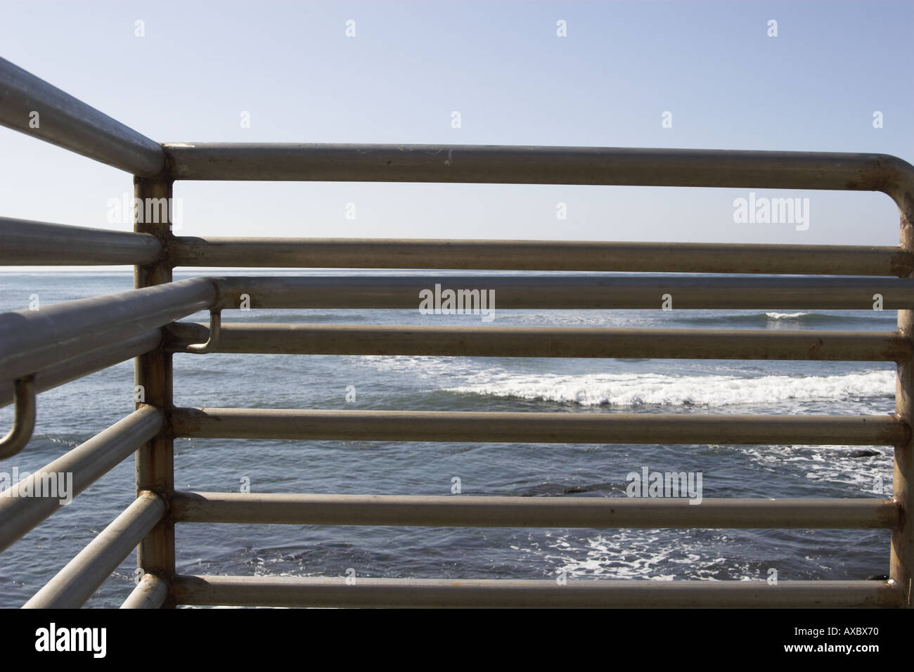 Railing looking out towards ocean Stock Photo - Alamy