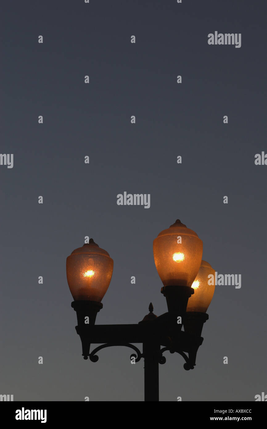 Three old street lamps, vertical view Stock Photo - Alamy