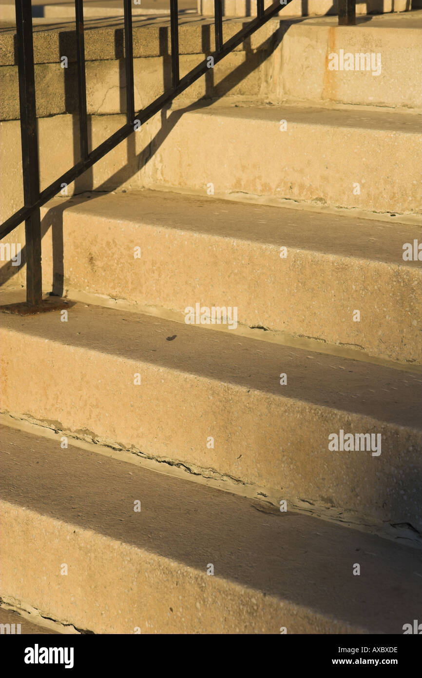 Steps and railing at sunset, vertical Stock Photo - Alamy