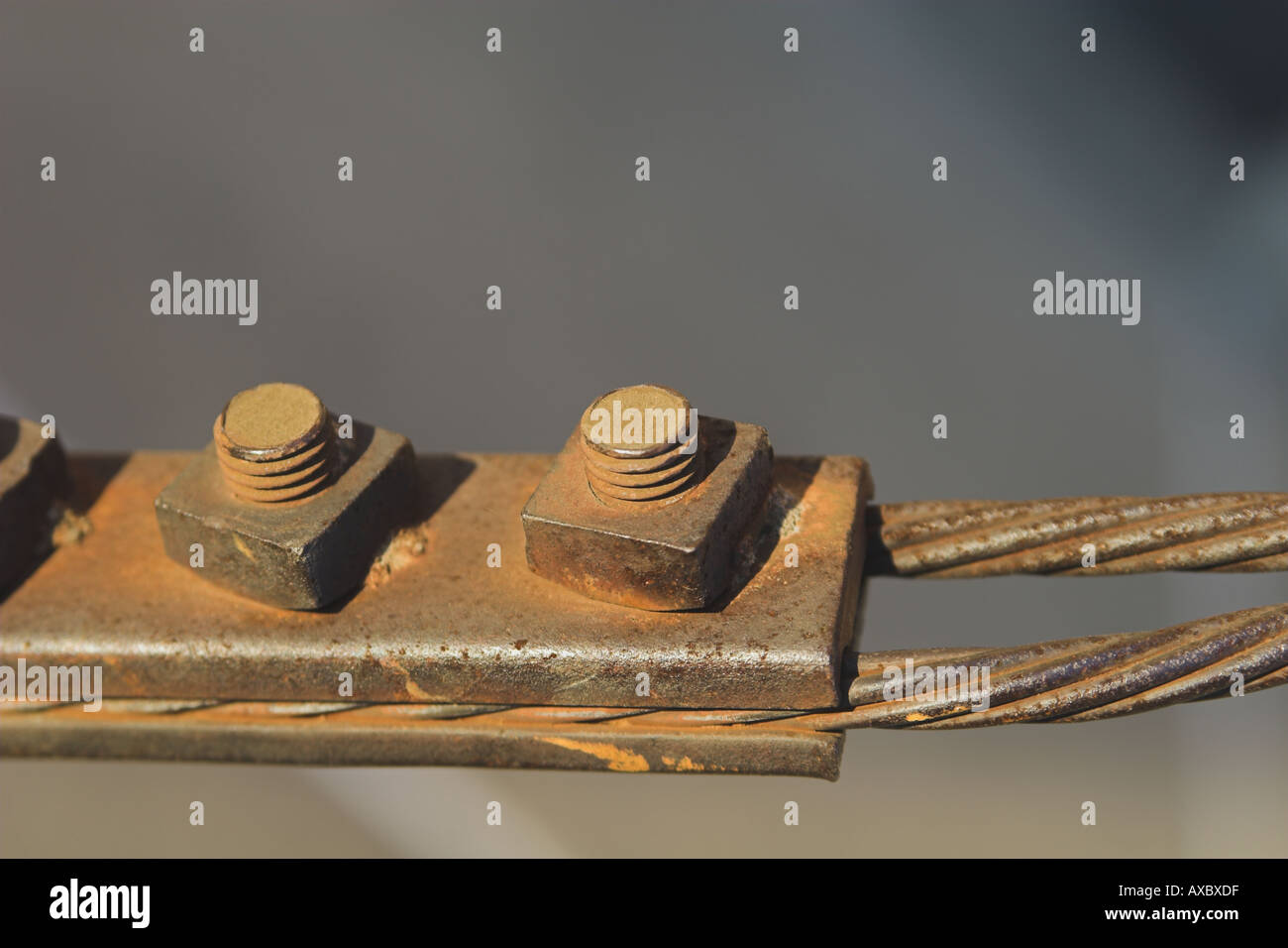 Rusted bracket, cables, nuts, and bolts Stock Photo - Alamy