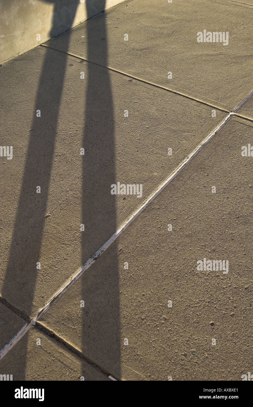 Shadows on pavement Stock Photo - Alamy