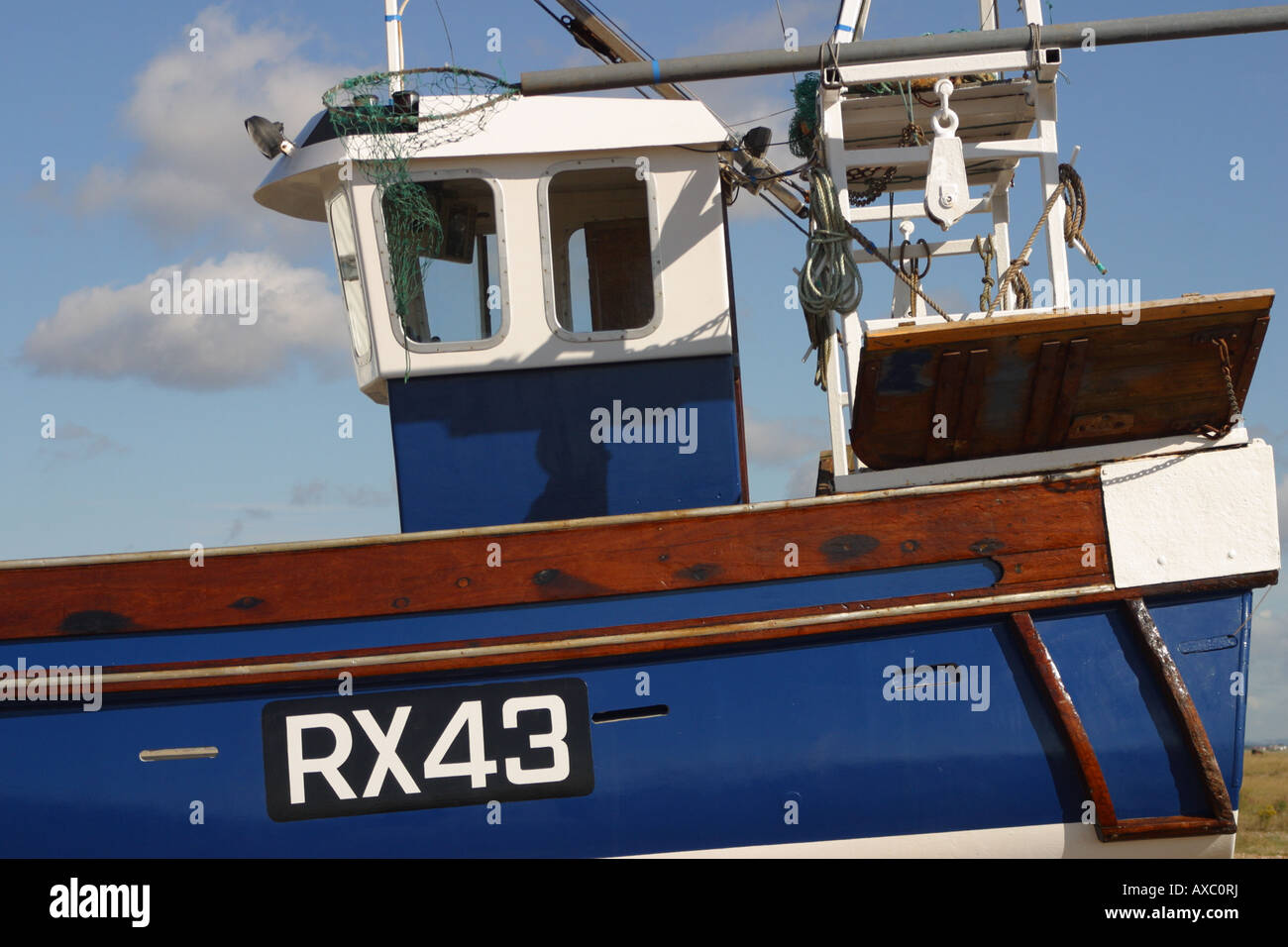 helm converted fishing boat lifeboat retired sky Stock Photo - Alamy