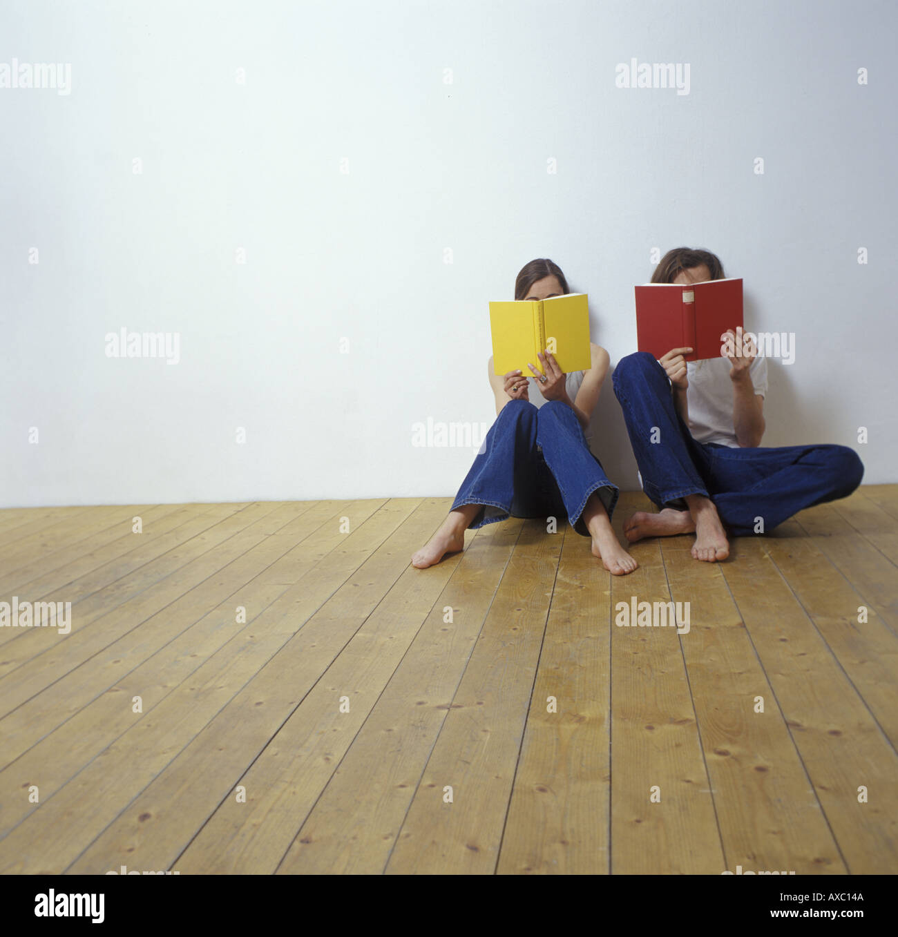 Two people reading books Stock Photo - Alamy