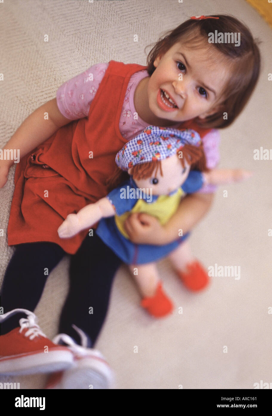 girl with doll Stock Photo - Alamy
