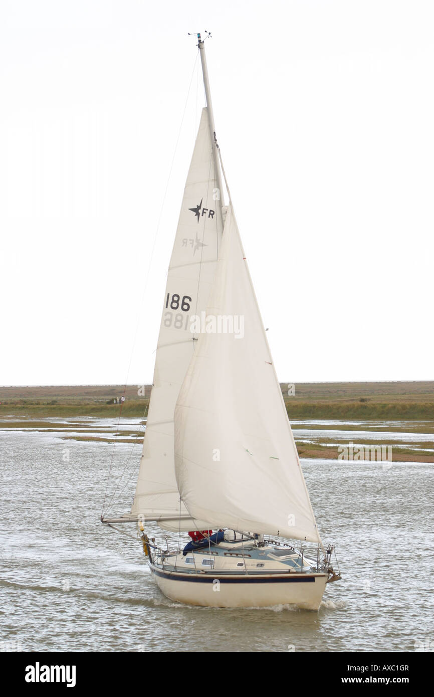 white sunlit twin sail sailing boat mast rigging river rother rye east ...