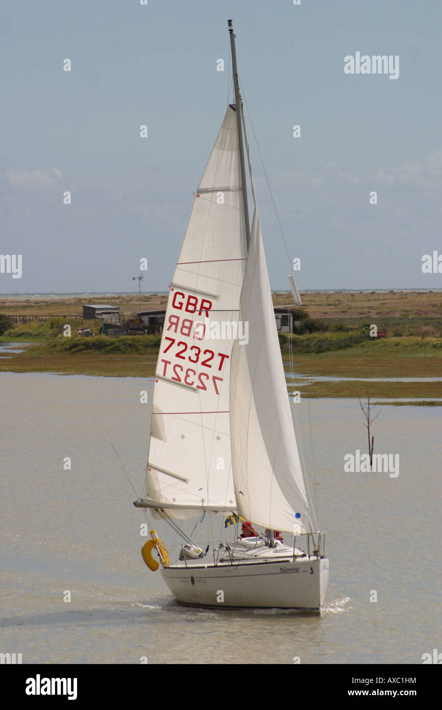 white sunlit twin sail sailing boat mast rigging river rother rye east ...