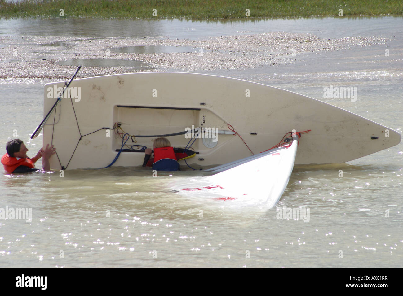 upturned curled sail sailing boat deck capsized river rother rye east ...
