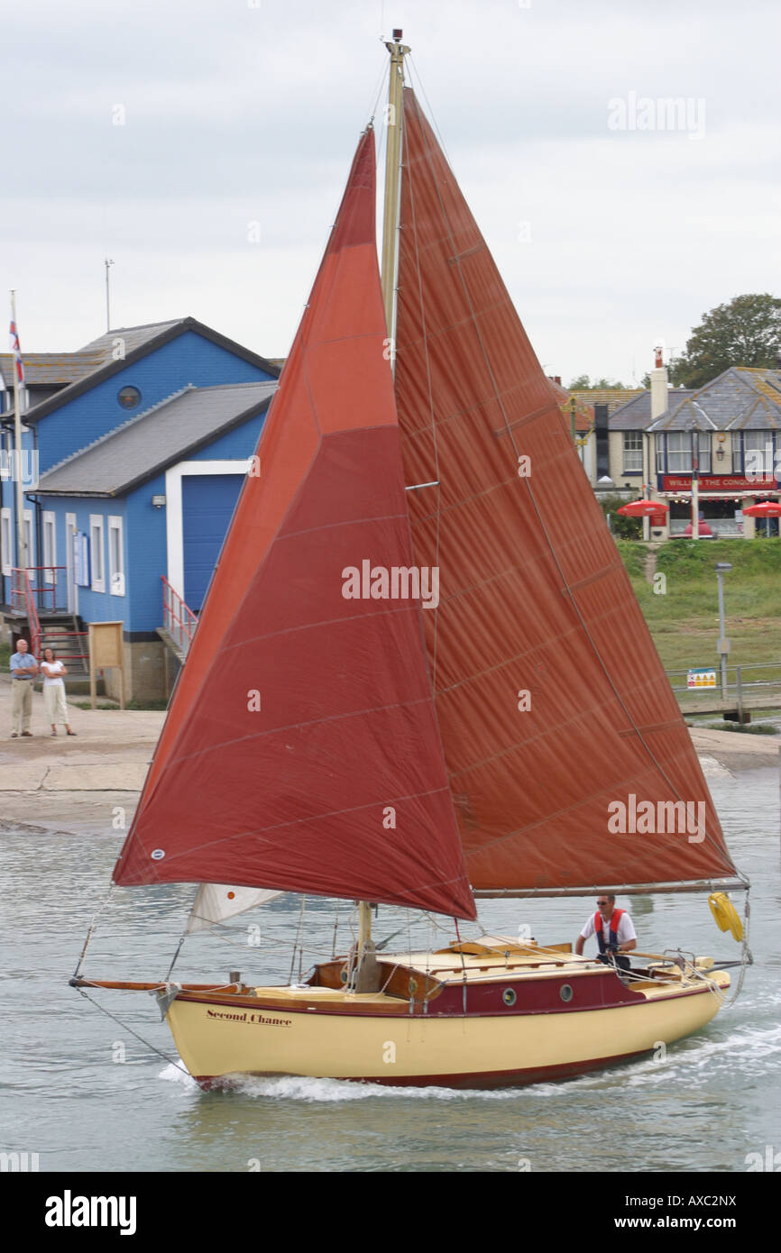 red triangle raised yellow hull boat sailor river rother rye east ...
