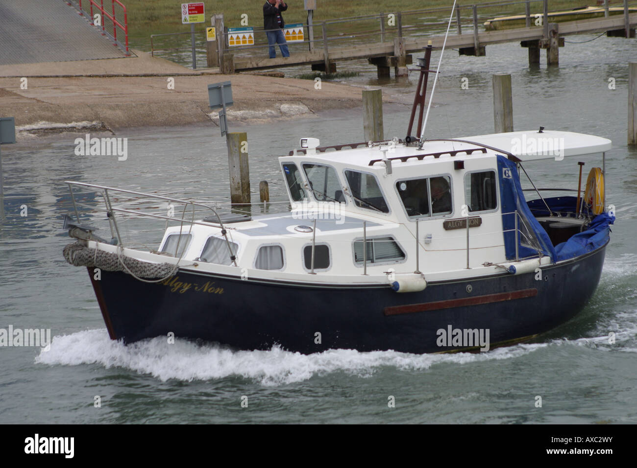 blue hull white cabin cruiser bridge boat surf river rother rye east ...