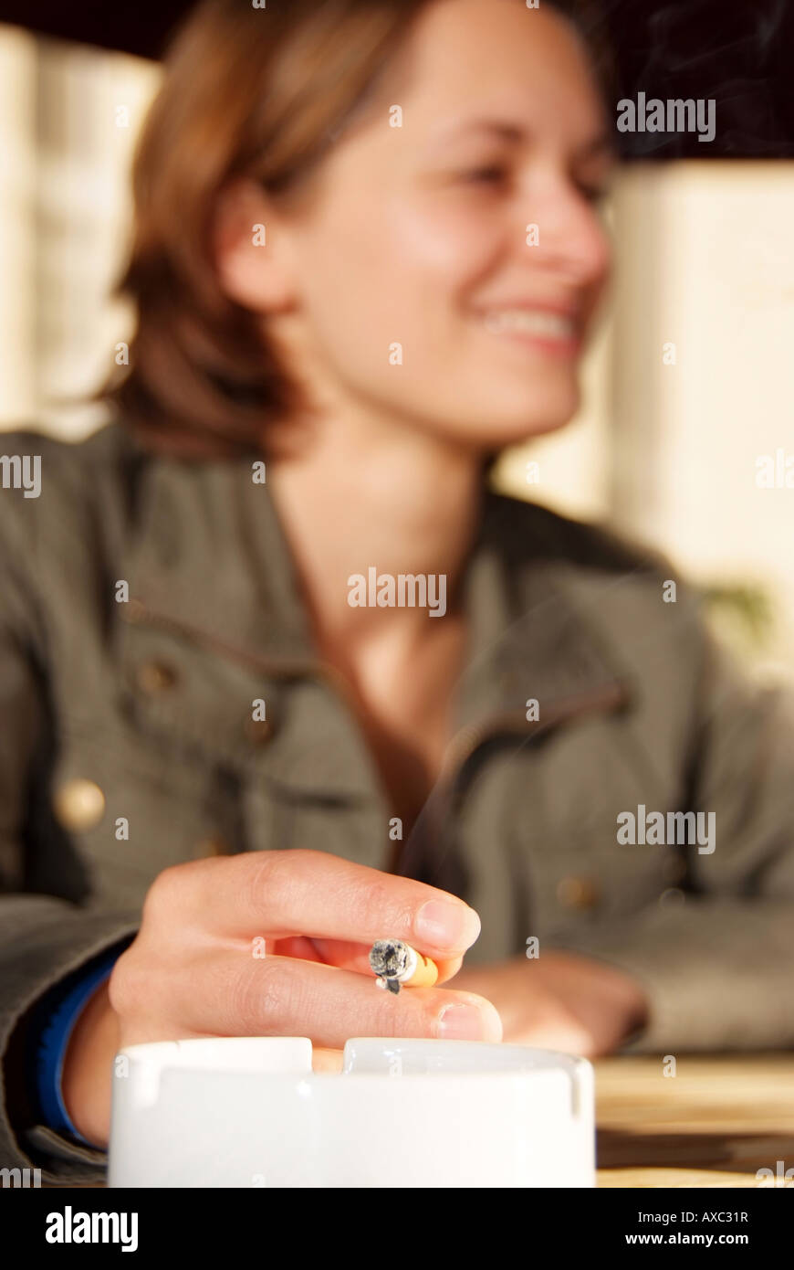 young woman smoking Stock Photo - Alamy