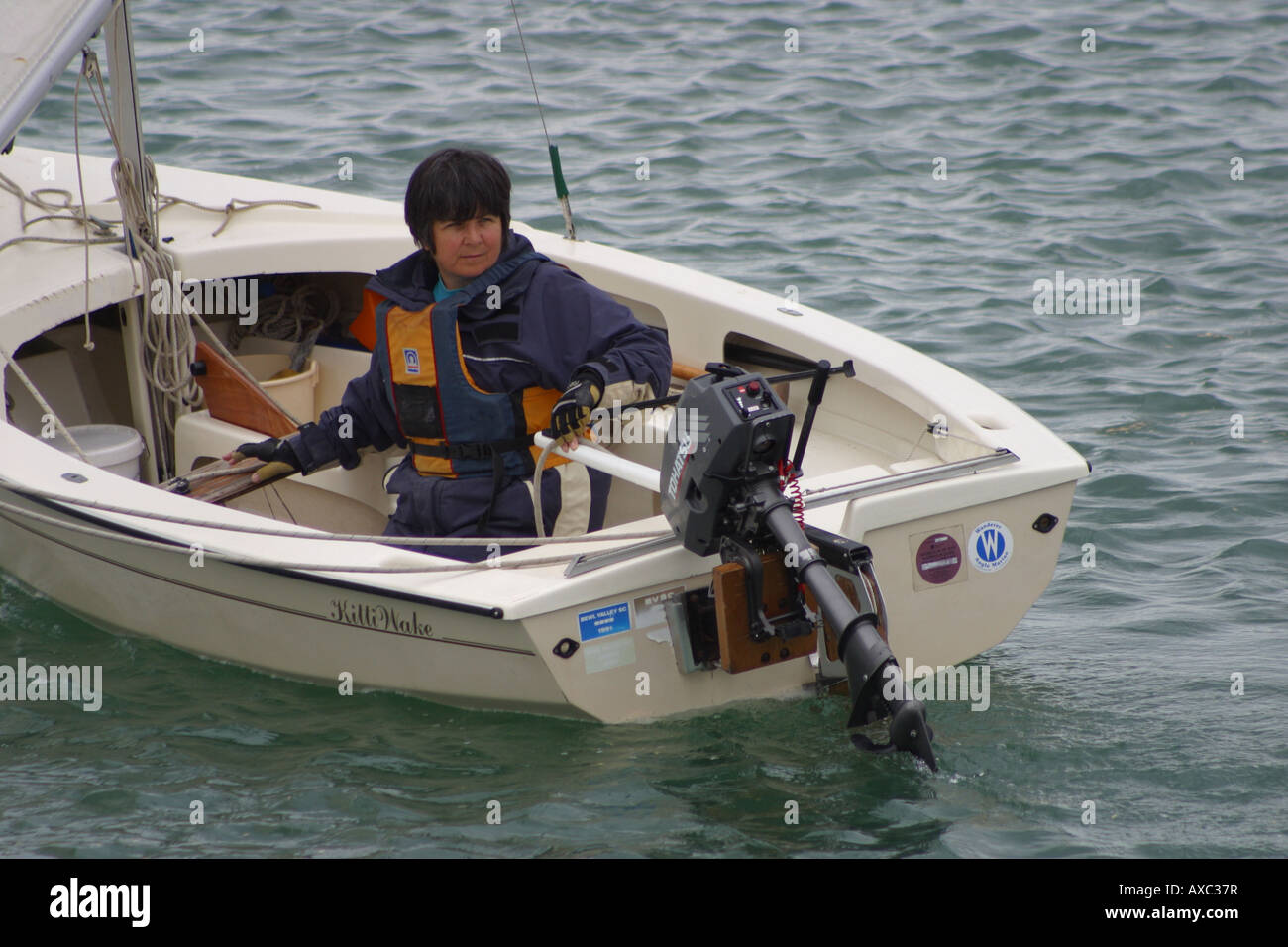 white rowing boat outboard motor raised sailor river rother rye east ...