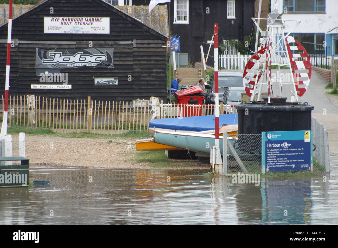 high tide black wooden huts buildingslipway boat river rother rye east ...