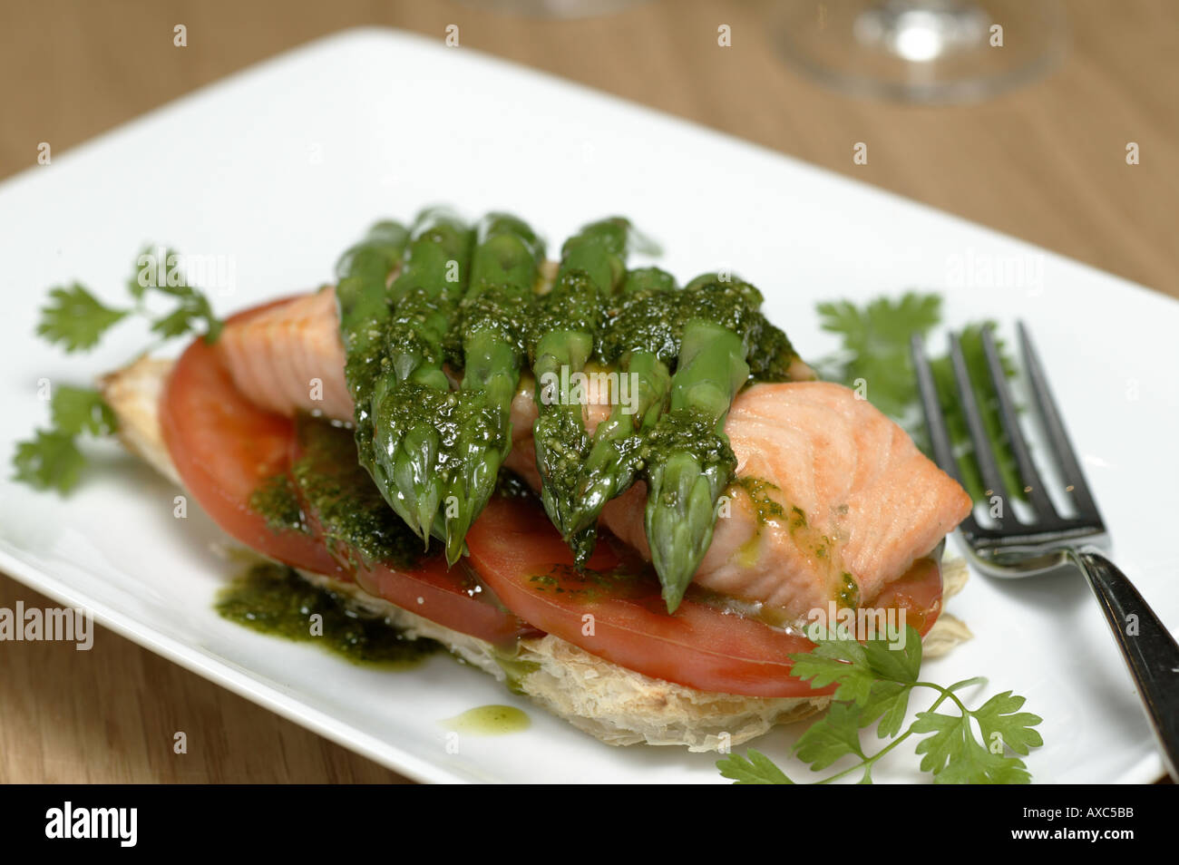 Salmon and Asparagus main course meal Stock Photo - Alamy