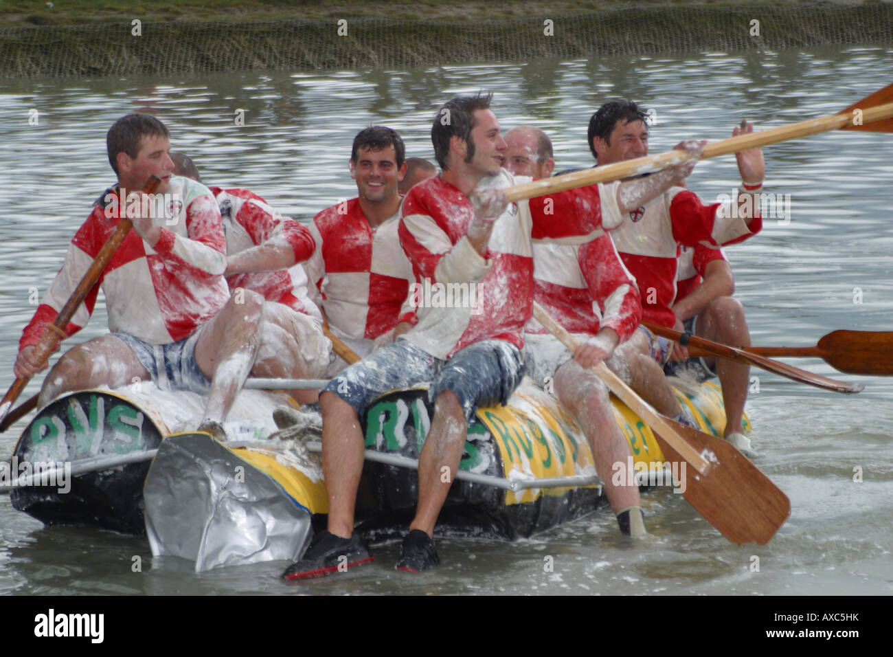 raft race competitors rowing river paddles anarchy Stock Photo - Alamy