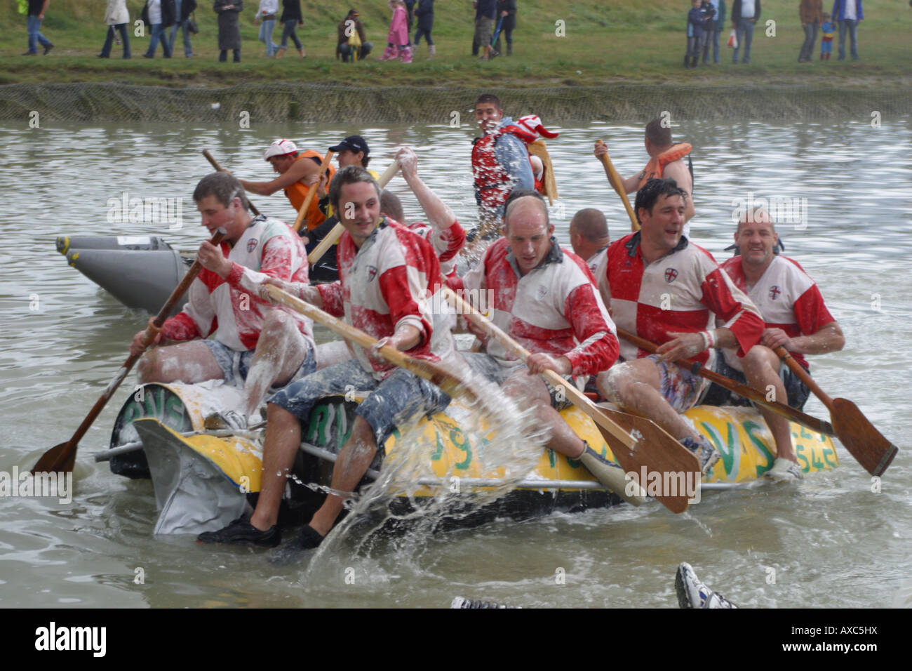 raft race competitors rowing river paddles crash Stock Photo - Alamy