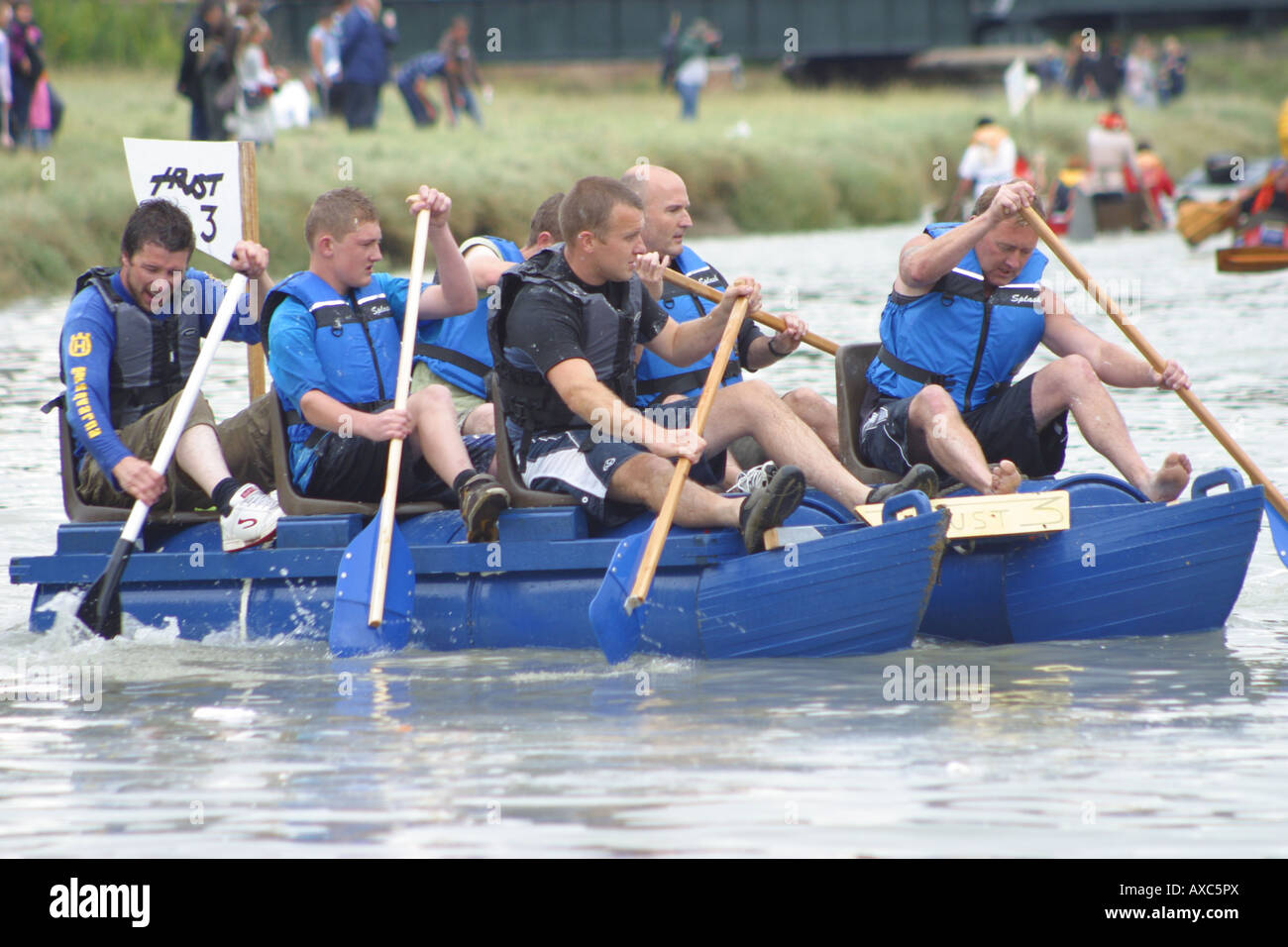 raft race competitors rowing river paddles oars Stock Photo - Alamy