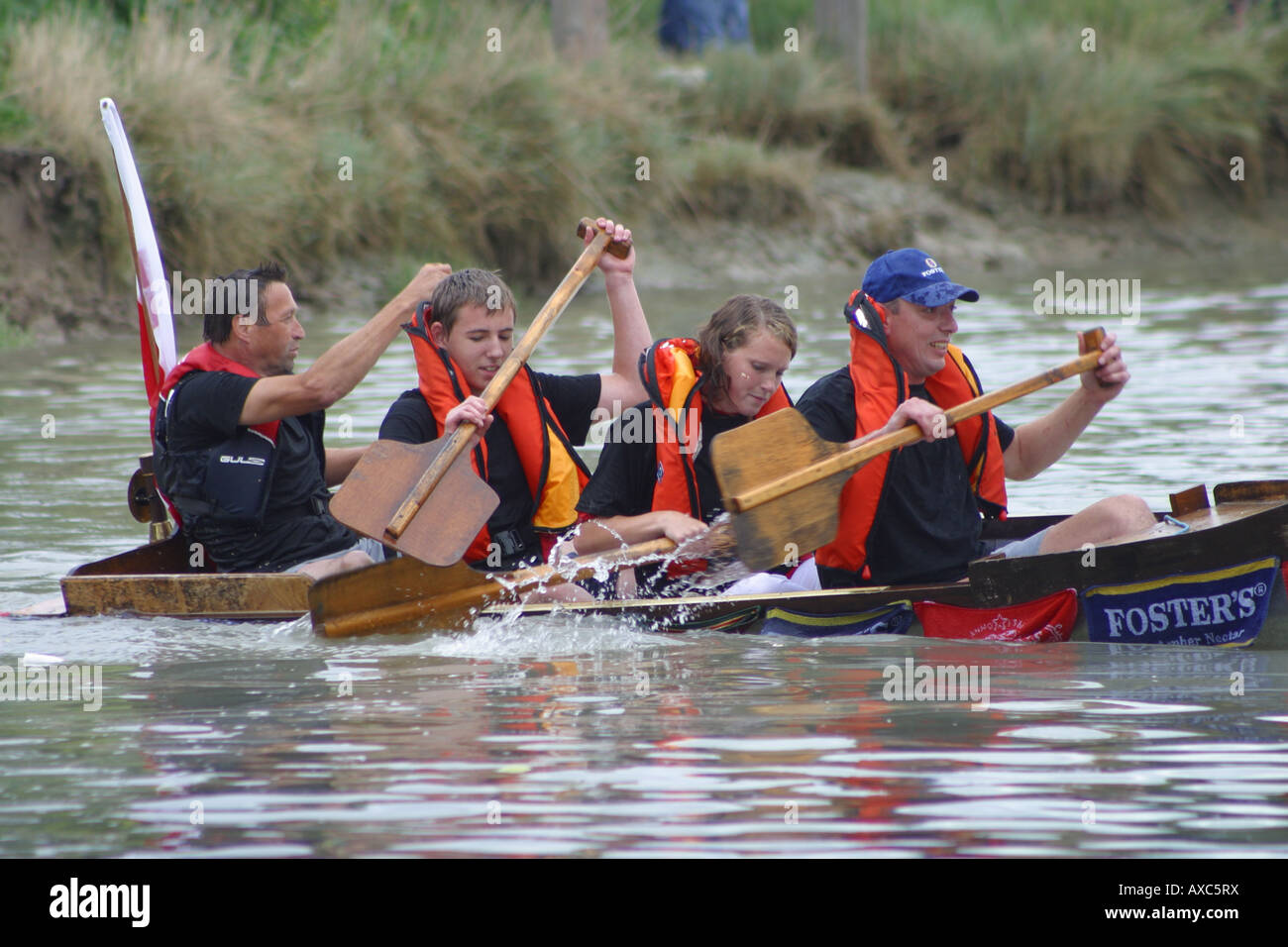 raft race competitors rowing river paddles water Stock Photo - Alamy