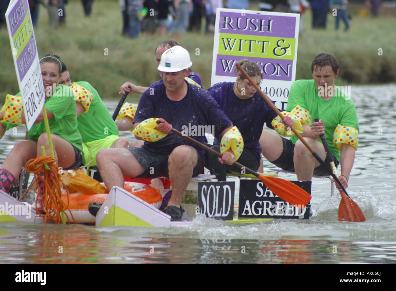raft race competitors rowing river paddles focus Stock Photo - Alamy