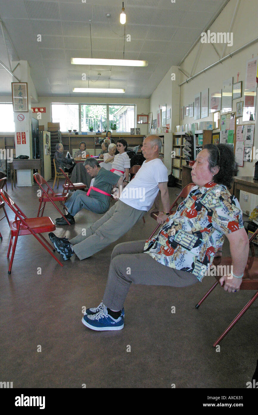 Chinese elders exercise at a day centre in North London GB UK pensioner ...