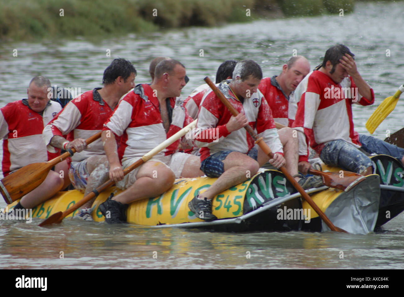 raft race competitors rowing river paddles water Stock Photo - Alamy