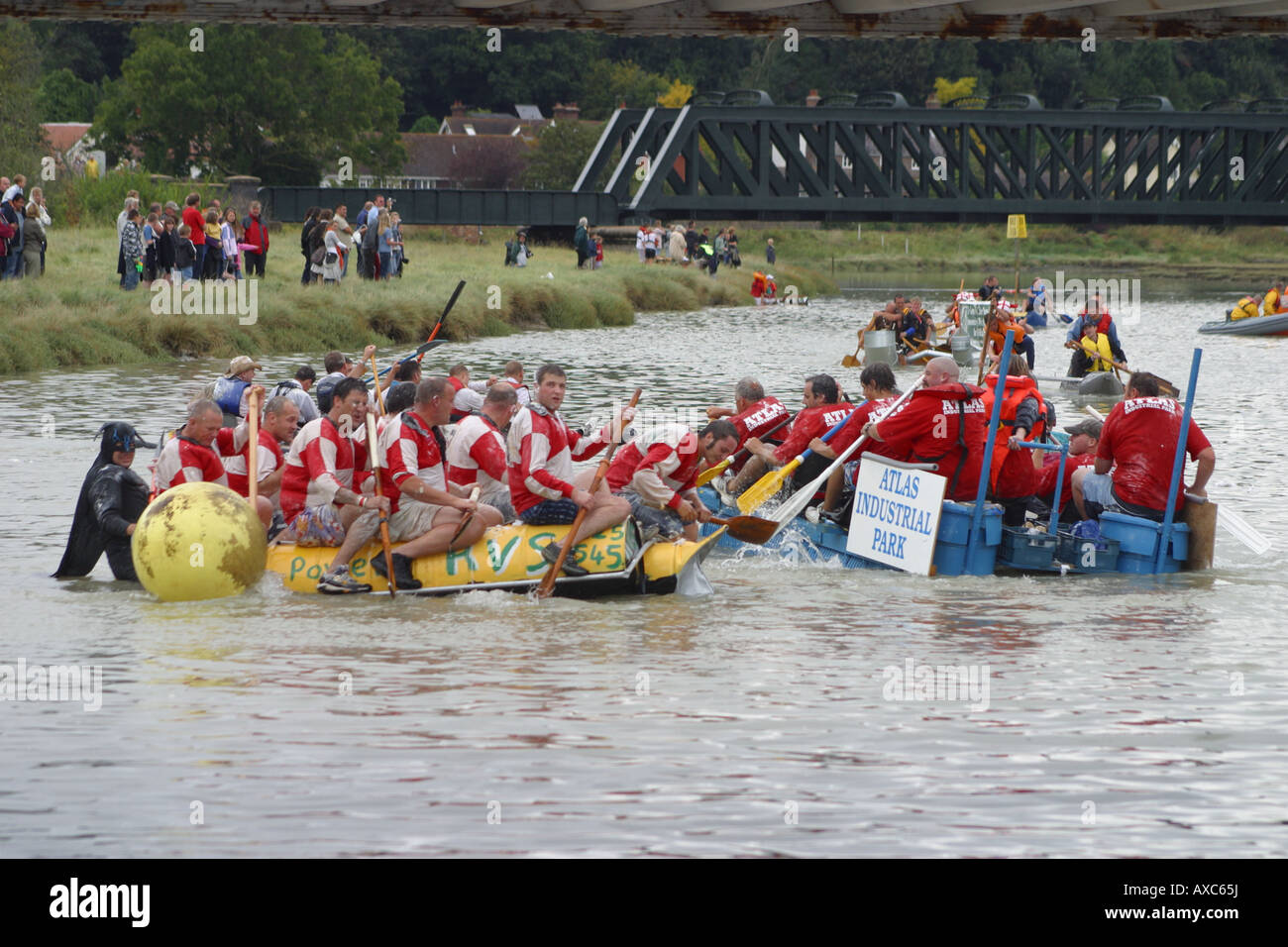 raft race competitors rowing river paddles water Stock Photo - Alamy