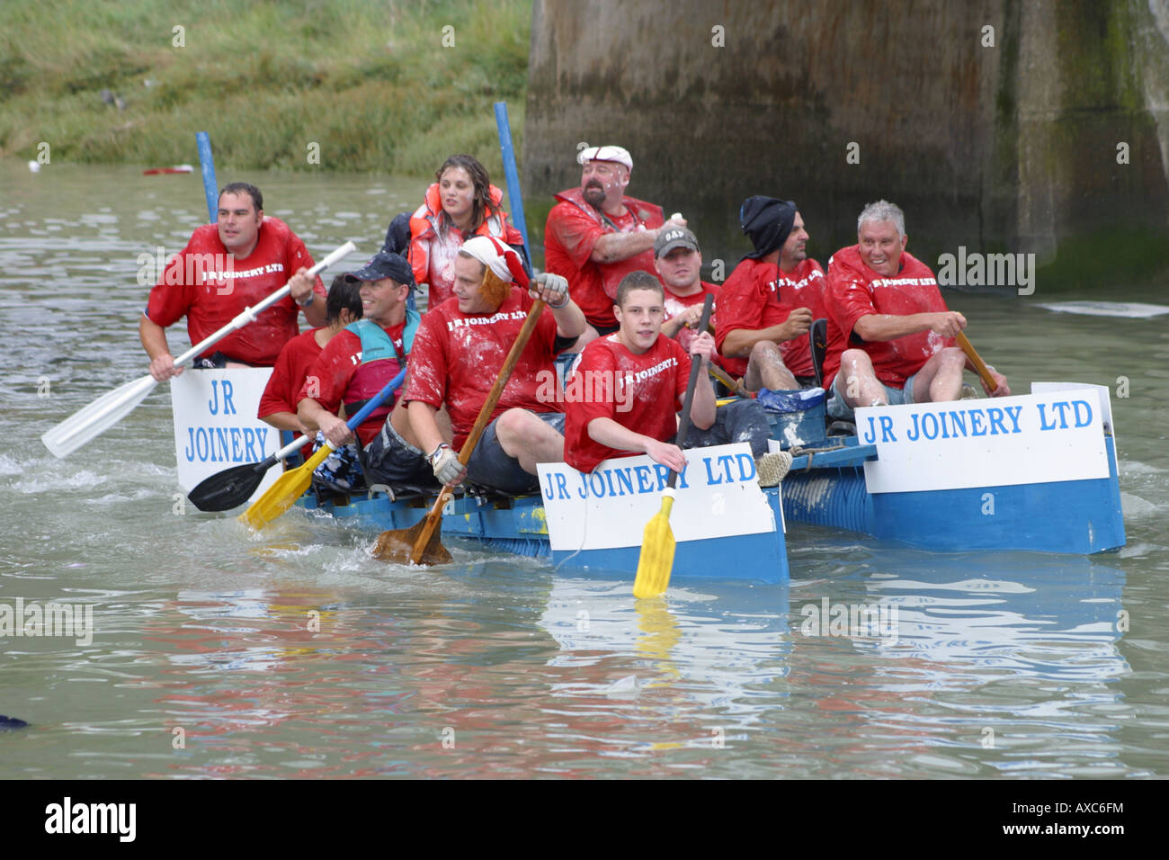 raft race competitors rowing river oars row water Stock Photo - Alamy