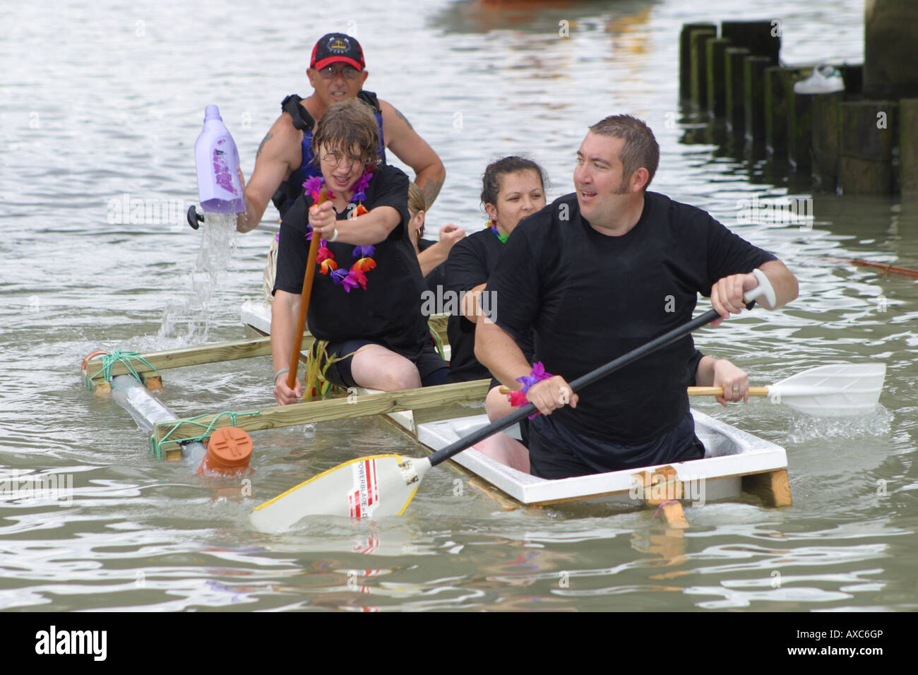 raft race competitors rowing river oars row water Stock Photo - Alamy