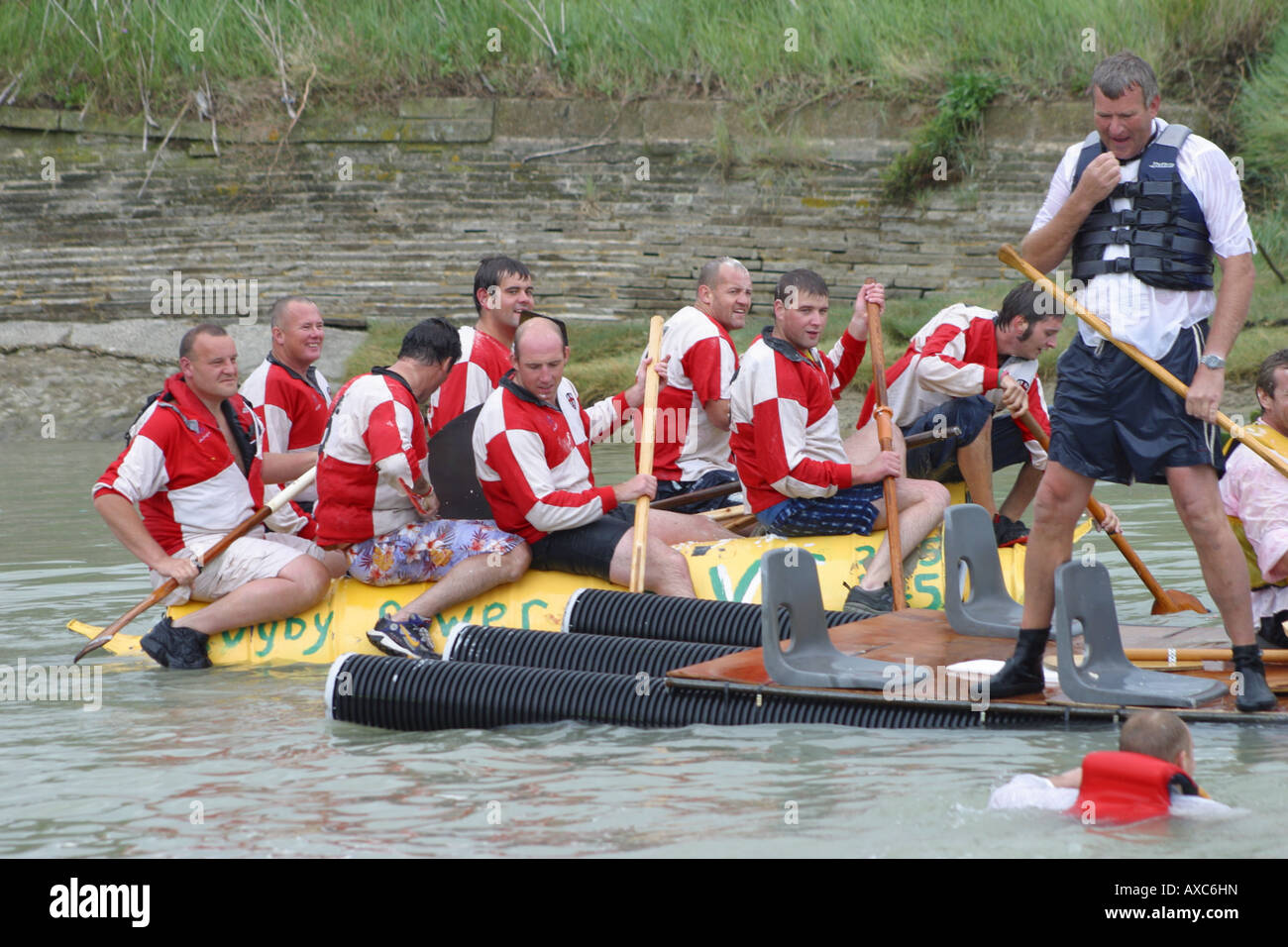 raft race competitors rowing river oars row water Stock Photo - Alamy
