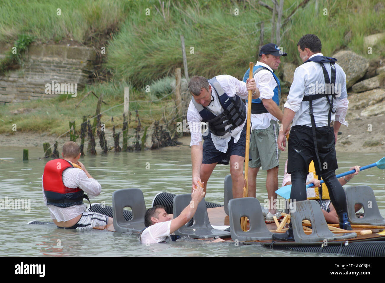 raft race competitors being pulled out of river Stock Photo - Alamy