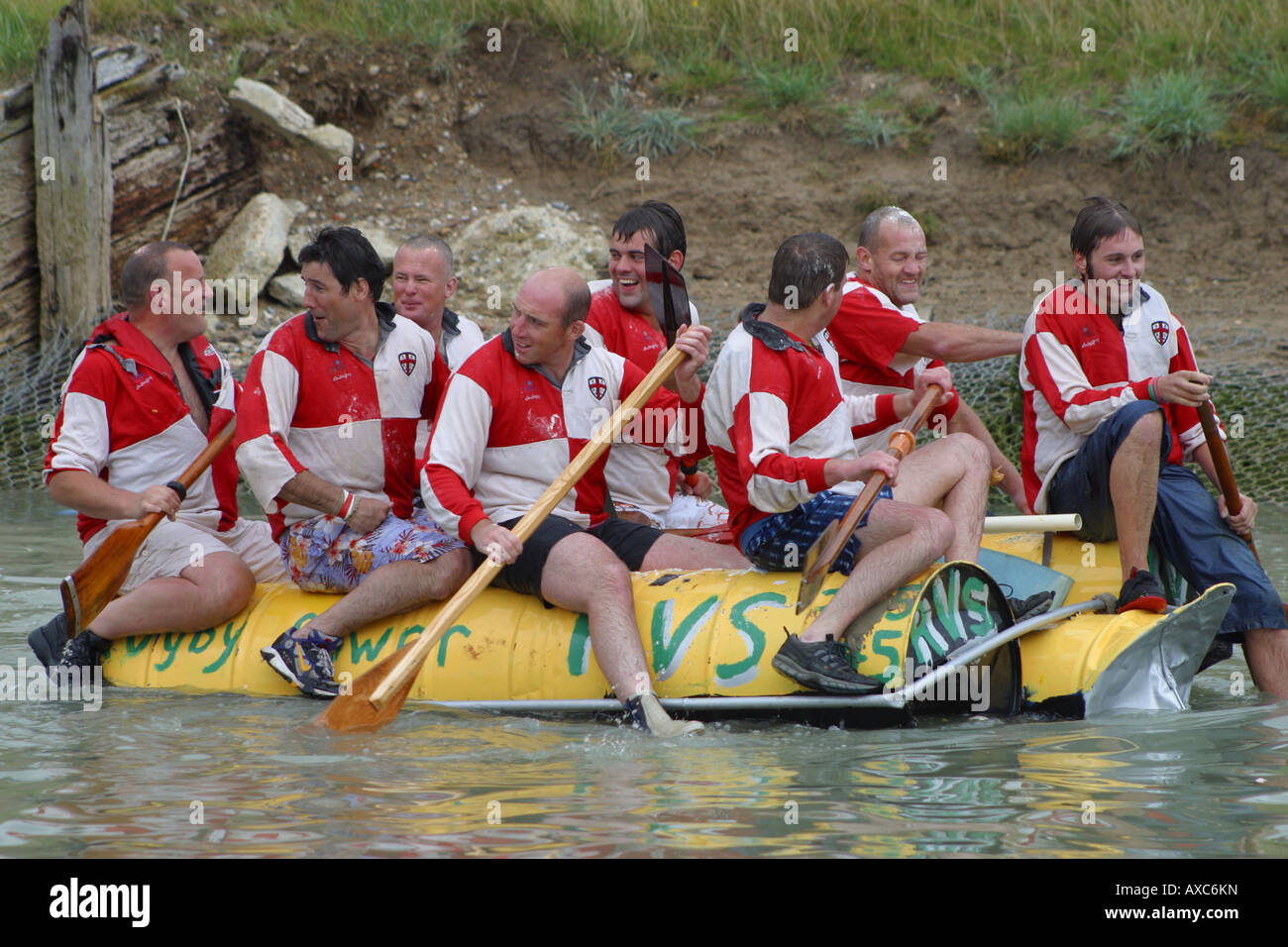 raft race competitors rowing river oars row water Stock Photo - Alamy