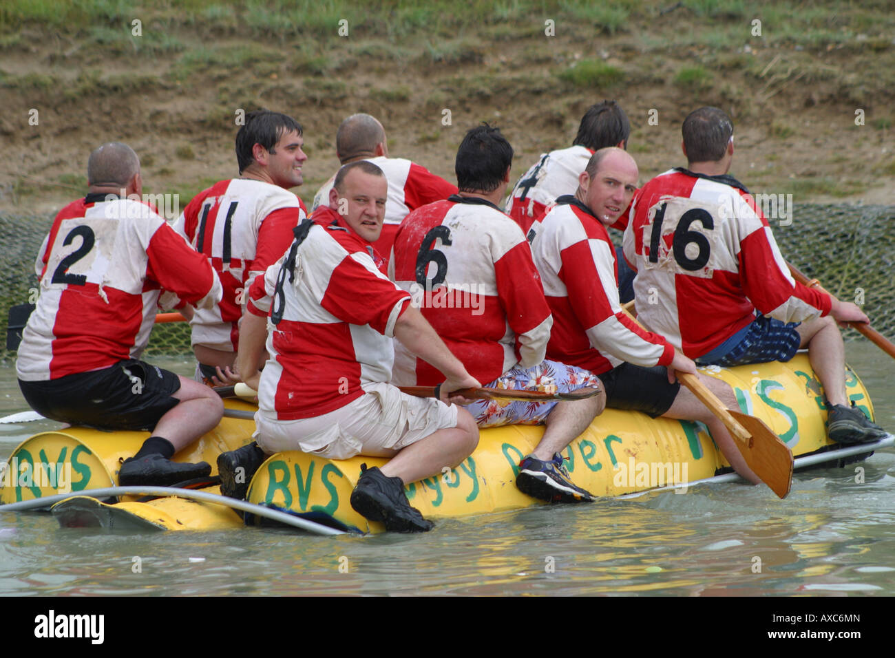 raft race competitors rowing river oars row water Stock Photo - Alamy
