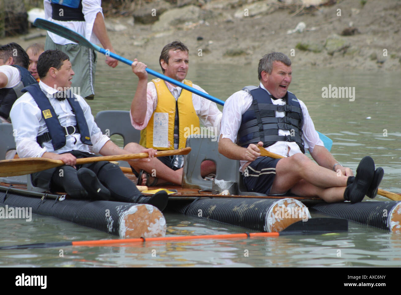 raft race competitors rowing river oars row water Stock Photo - Alamy