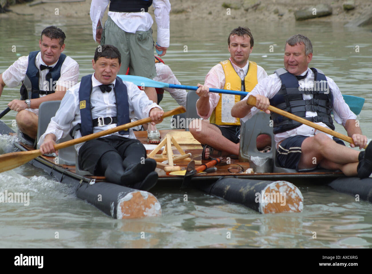 raft race competitors rowing river oars row water Stock Photo - Alamy