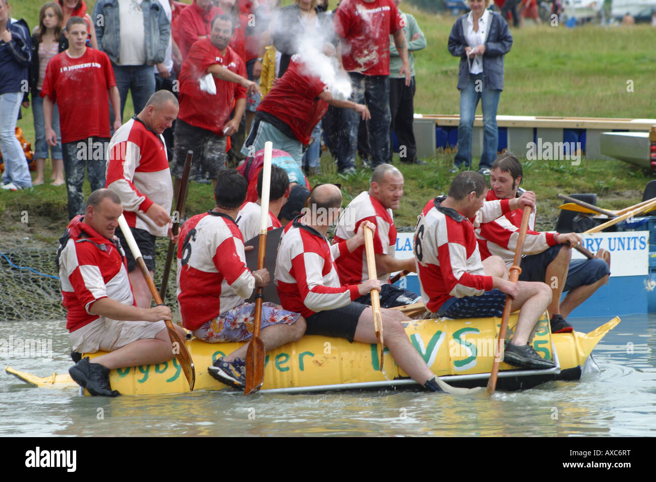 raft race competitors rowing river paddles water Stock Photo - Alamy