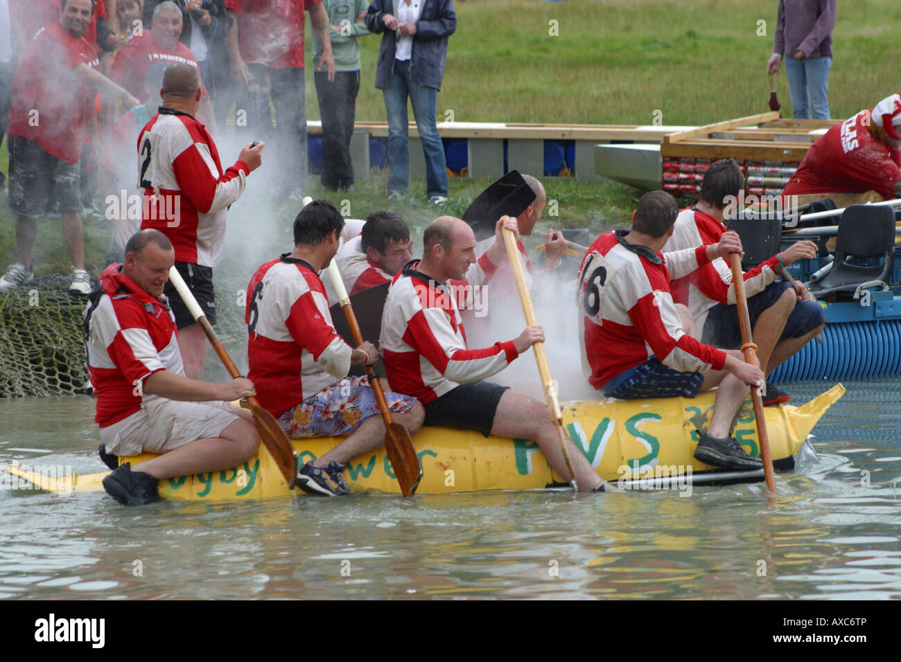 raft race competitors rowing river paddles flour Stock Photo - Alamy
