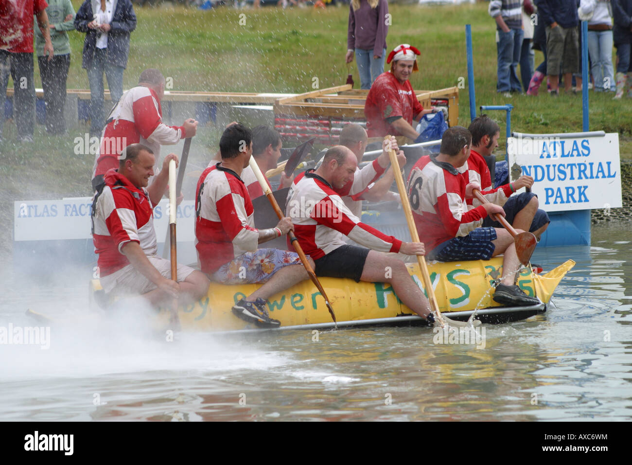 raft race competitors rowing river paddles water Stock Photo - Alamy
