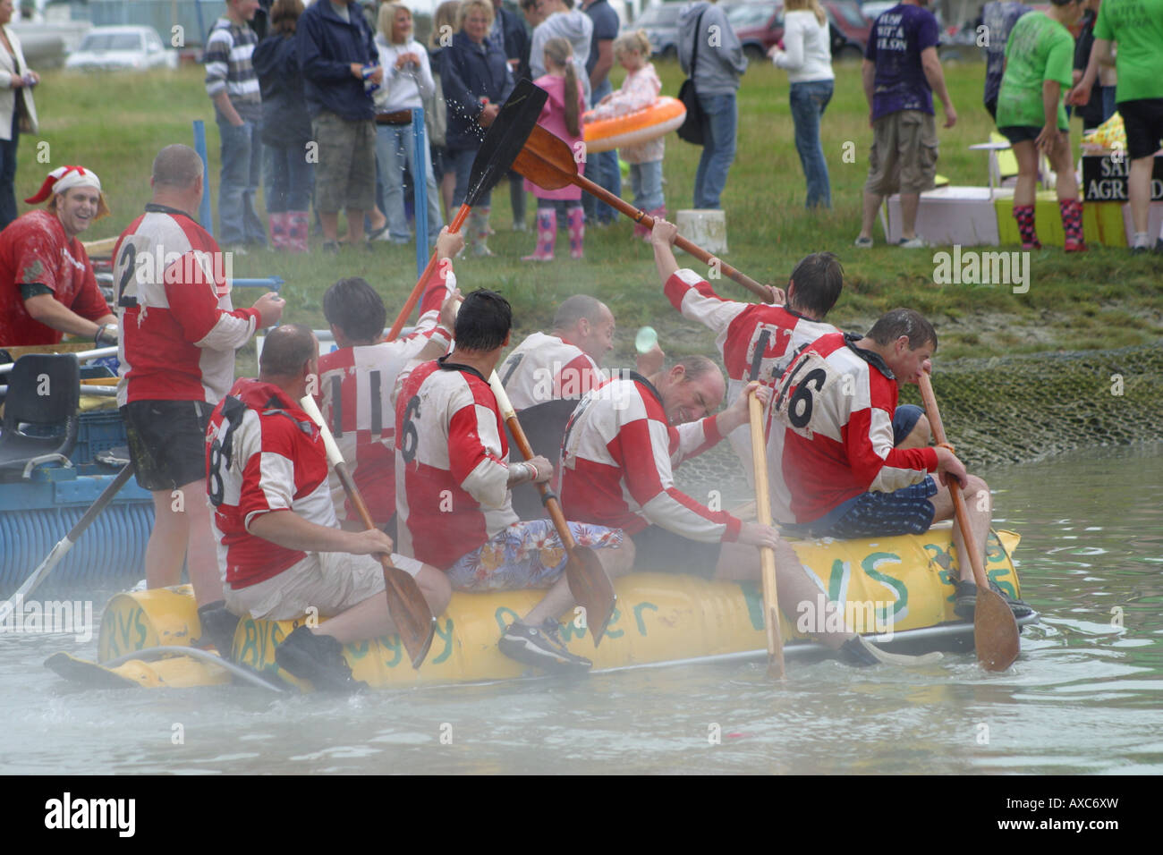raft race competitors rowing river paddles water Stock Photo - Alamy