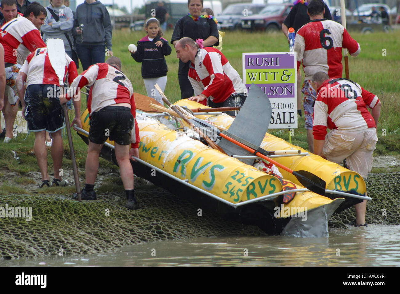 raft race competitors removing exiting pulling Stock Photo - Alamy