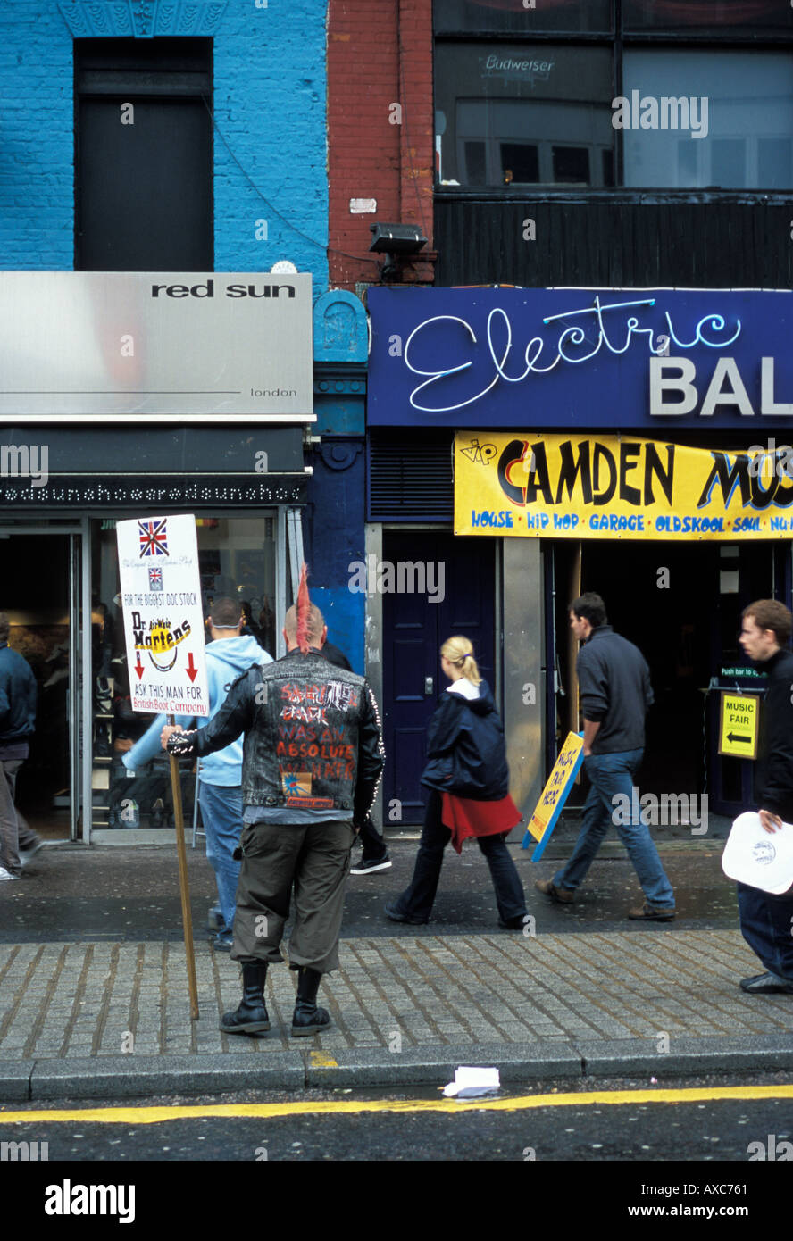 A punk advertising Dr Marten shoes at the Camden Town Market in London ...
