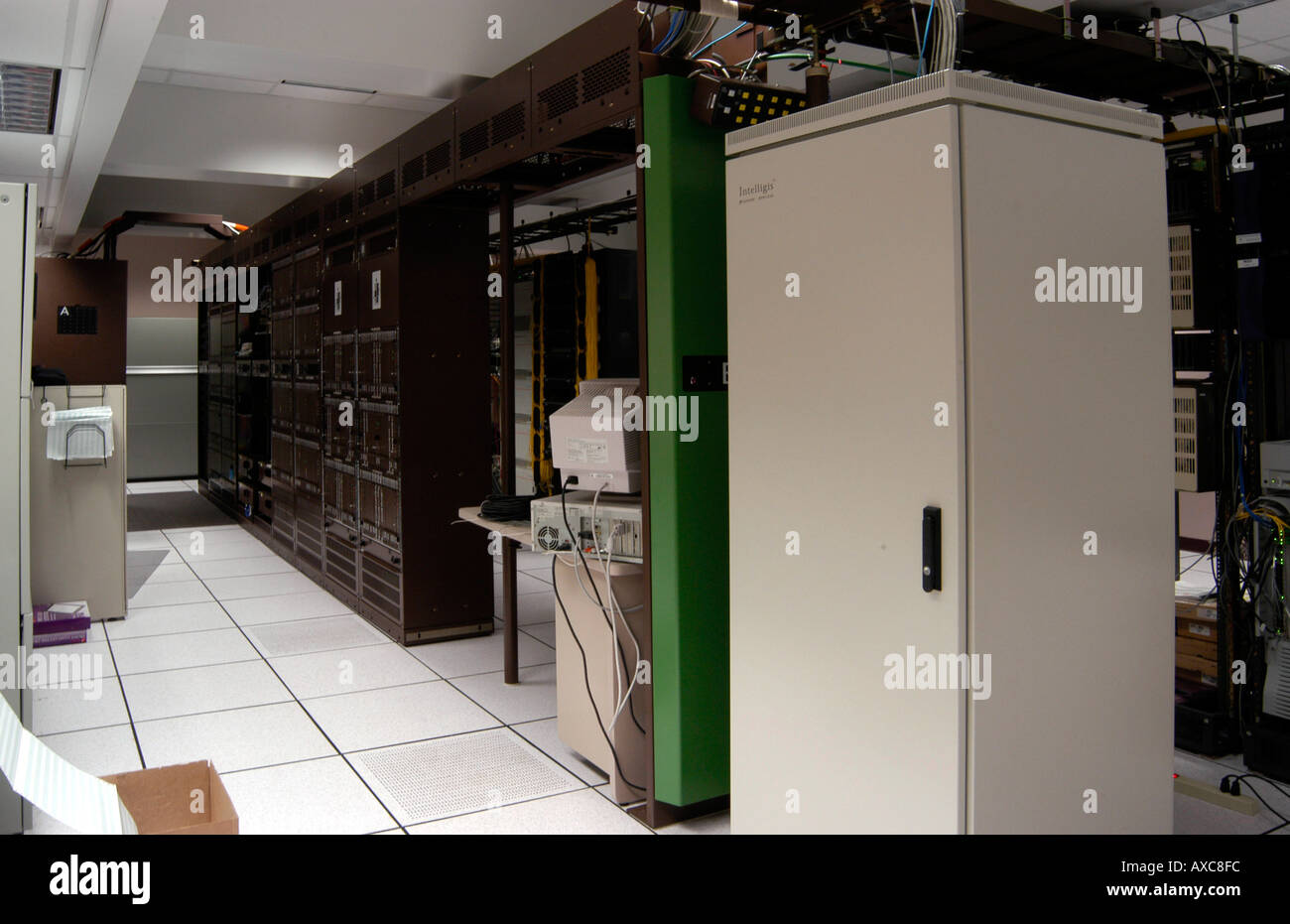 Telecommunications network switching room showing computer and network ...