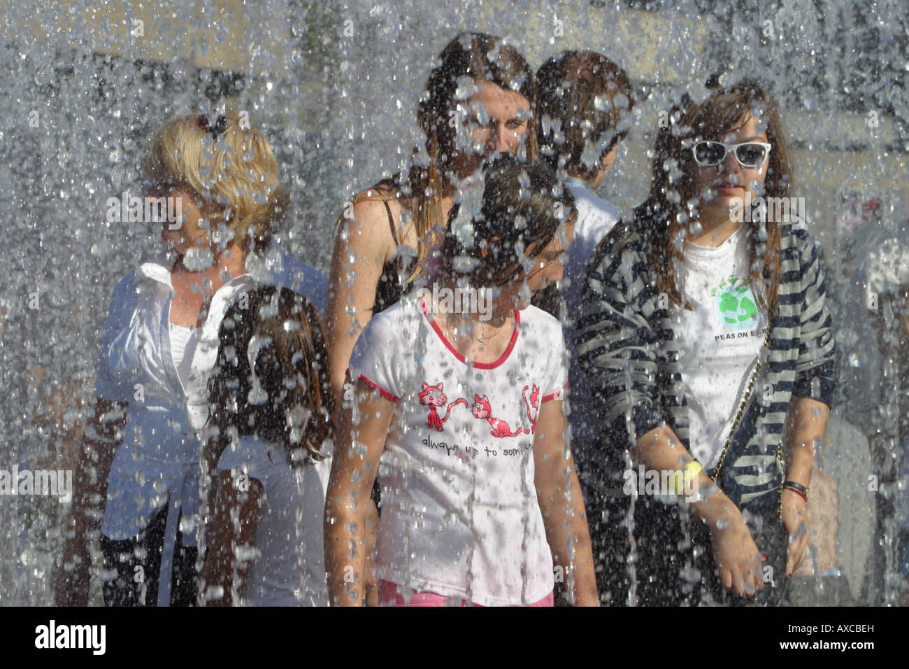 women girls females water wall droplets fountain thames festival Stock ...