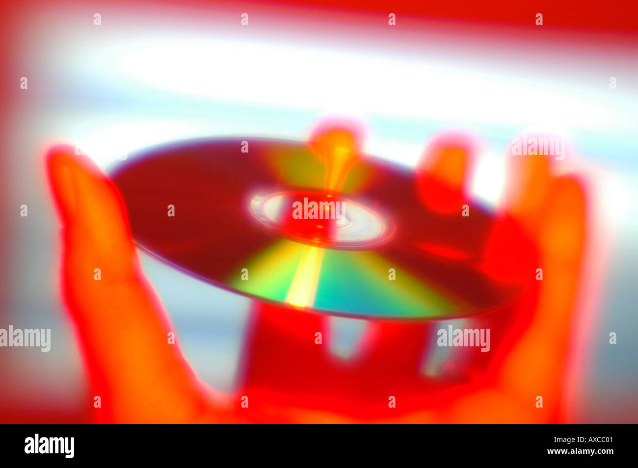 stylized computer disc in hand bold red color Stock Photo - Alamy